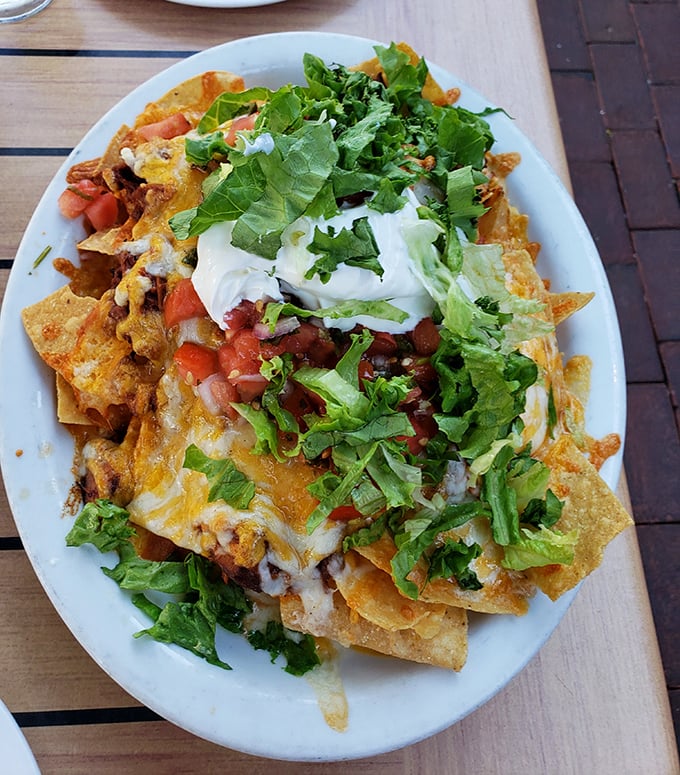 These loaded nachos aren't just a starter&mdash;they're a commitment to happiness, layered with cheese, fresh veggies, and enough toppings to require a strategy.