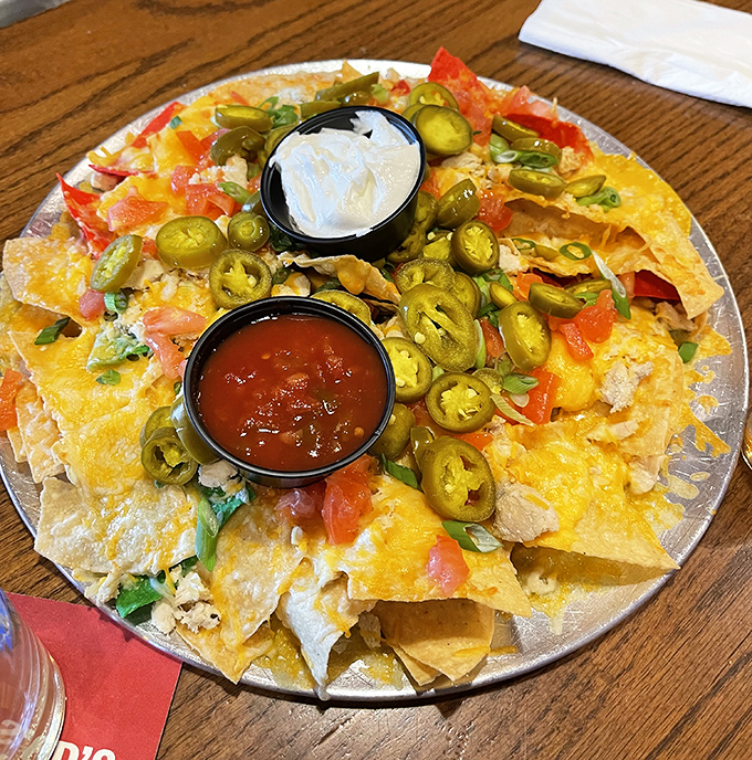 These loaded nachos aren't messing around. Jalapeños, melted cheese, and all the fixings create a sharable masterpiece—if you're feeling generous.
