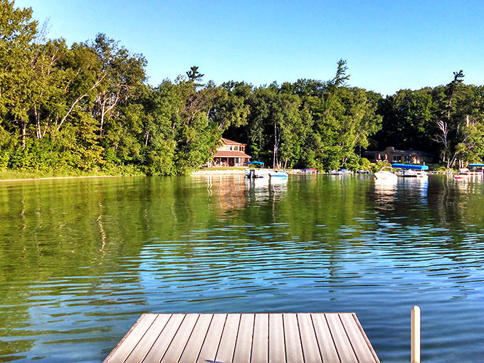 Lake Leelanau's tranquil waters reflect the surrounding forest like nature's own Instagram filter. No wonder cottages here are family treasures.