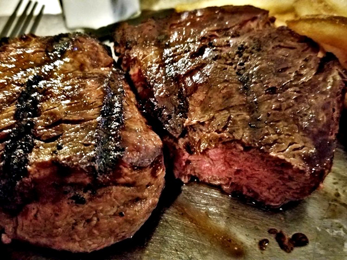Grill marks that tell a story. These expertly seared New York strips showcase the kitchen's commitment to proper technique and temperature control.