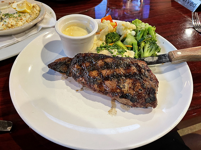 A perfectly seared New York Strip with just the right char marks—proof that simplicity, when executed flawlessly, needs no fancy embellishment.