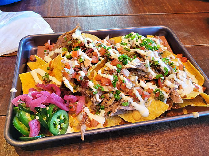 Nachos reimagined by smoke wizards &ndash; a mountain of chips, meat, and toppings that makes sharing both necessary and nearly impossible.