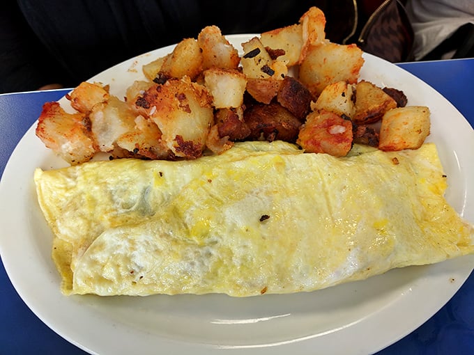 An omelet should be a fluffy envelope delivering good news to your taste buds. This one arrives with a side of perfectly crisped home fries.