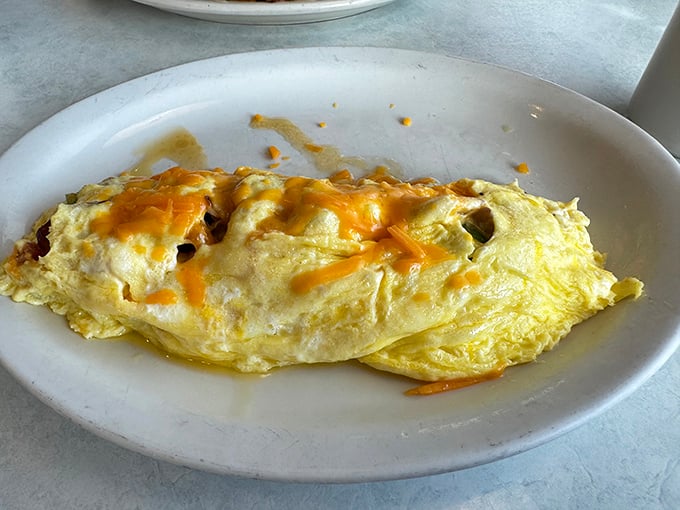 Behold the humble omelet, elevated to art form &ndash; fluffy eggs embracing melted cheese in a relationship more perfect than Danny and Sandy in "Grease."
