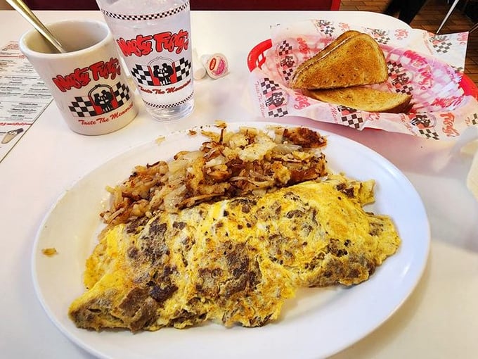 This isn't just breakfast&mdash;it's edible sunshine on a plate, where that perfectly executed omelet shares real estate with hash browns that mean business.