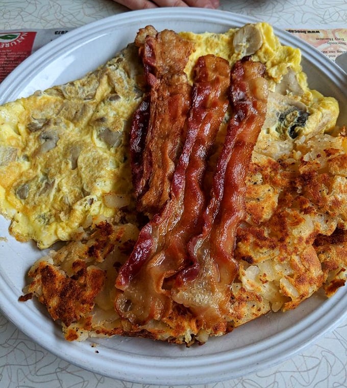 This mushroom omelet with crispy bacon strips isn't just breakfast&mdash;it's edible therapy for whatever ails you.