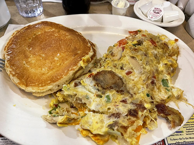 The ultimate breakfast compromise &ndash; a fluffy omelet packed with veggies and a pancake so golden it deserves its own Olympic medal.