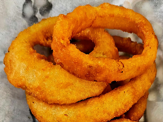 These onion rings aren't just fried&mdash;they're transformed into crispy golden halos that make you question why vegetables ever bothered growing any other way.
