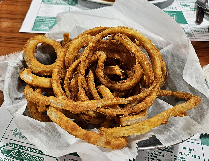 Onion rings stacked like golden halos waiting to ascend directly to your happy place.