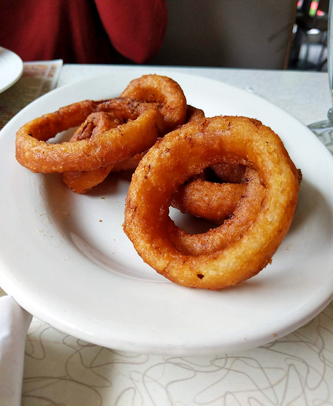 These onion rings aren't just fried&mdash;they're golden halos of crispy perfection that make you wonder why anyone bothers with fancy appetizers.