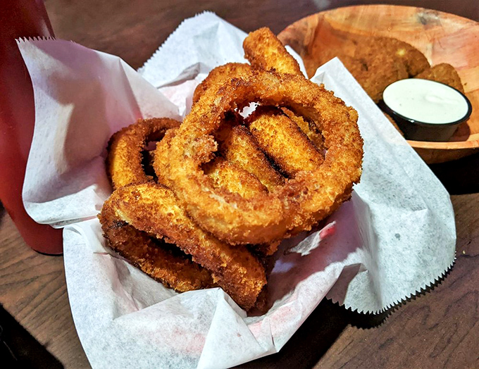Golden-brown onion rings that shatter with each bite&mdash;the perfect sidekick to a burger that requires both hands and a strategy.