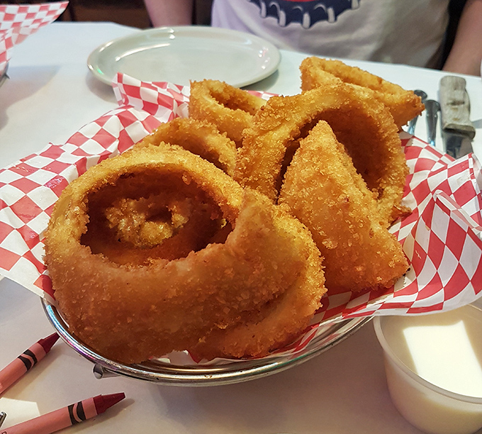 These aren't your average onion rings—they're golden halos of crispy perfection that somehow manage to maintain that satisfying crunch from first bite to last.