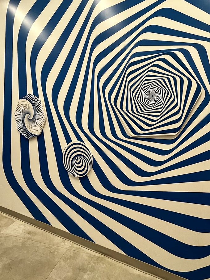 Hypnotic blue and white spirals pull you into their vortex. Like staring into the universe's most stylish washing machine on spin cycle.