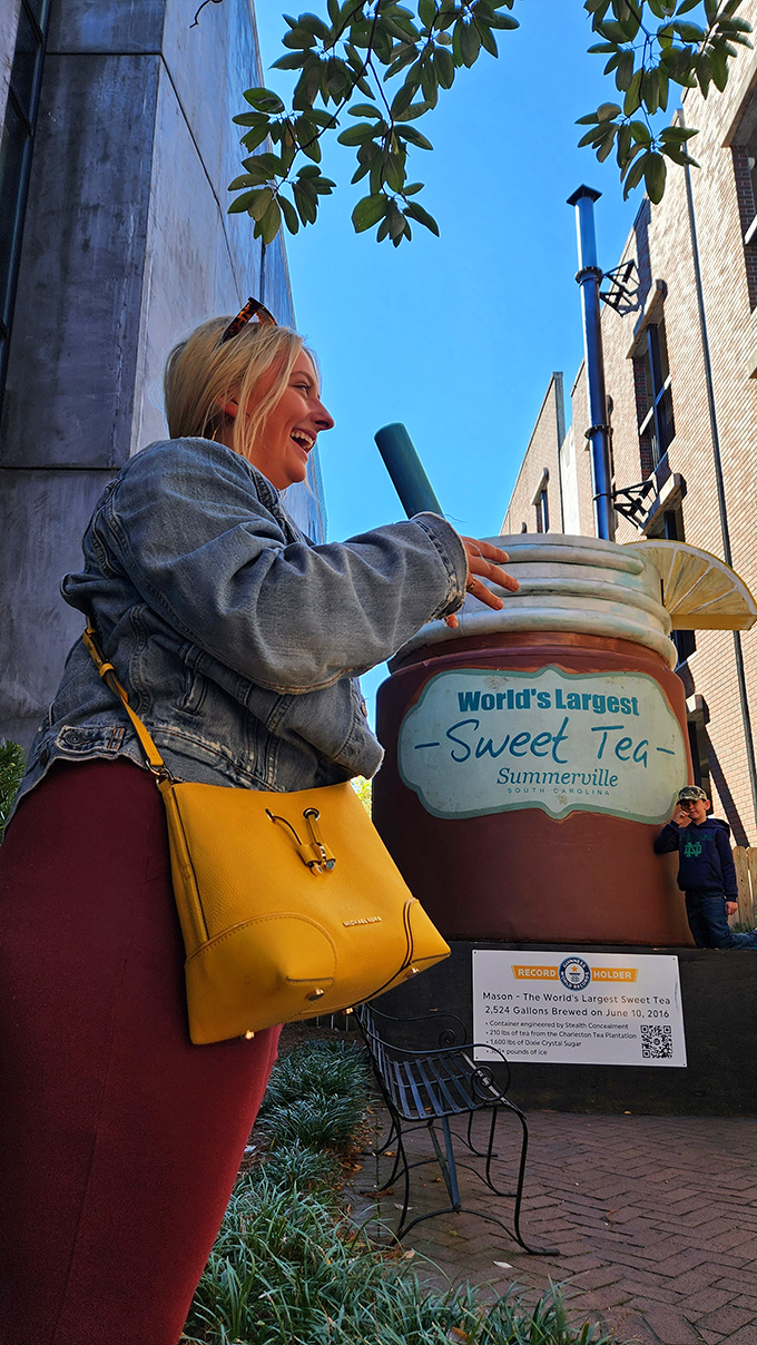 This visitor's joy perfectly captures the simple pleasure of roadside attractions. Sweet tea, sweet memories in the making. 