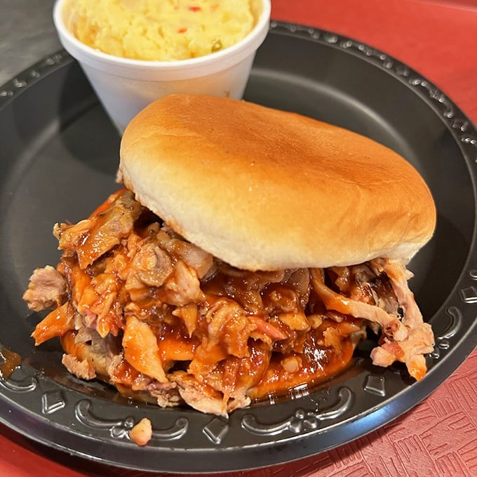 This isn't just a sandwich; it's a monument to pork perfection&mdash;tender, smoky meat with just enough sauce to complement, not drown, those hickory-kissed flavors. 