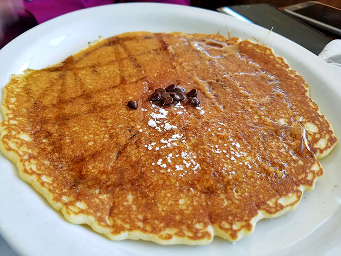 This pancake isn't just large&mdash;it's the size of your vacation ambitions, complete with melting chocolate chips.