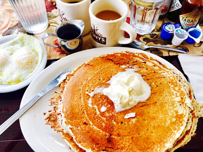 Pancakes so perfectly golden they deserve their own sunrise soundtrack. That melting butter pool in the center is nature's way of saying "good morning."