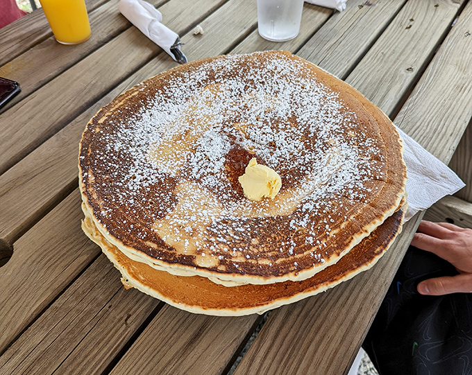 Golden-brown pancakes dusted with powdered sugar and topped with a melting pat of butter&mdash;the kind of simple perfection that makes you question fancy brunch spots.