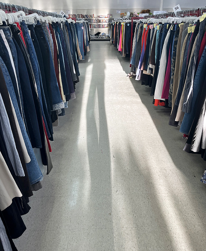 The denim highway stretches toward fashion salvation. In this aisle, someone else's "too tight" becomes your perfect fit.