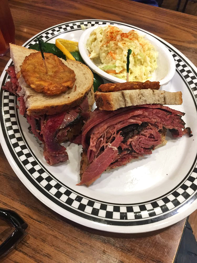 This isn't just a sandwich; it's a skyscraper of pastrami that would make any New Yorker nod in respectful approval.