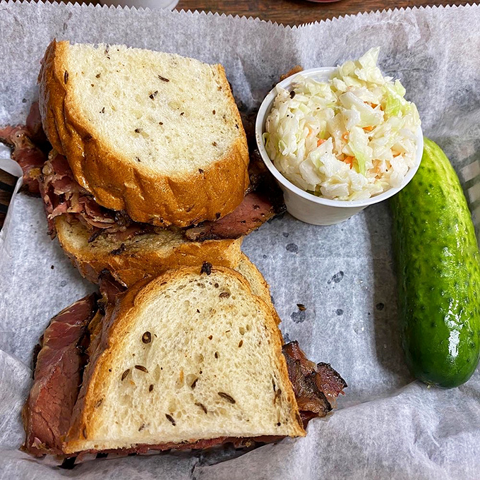 The pastrami sandwich towers higher than your retirement fund and delivers significantly more immediate satisfaction to your soul.