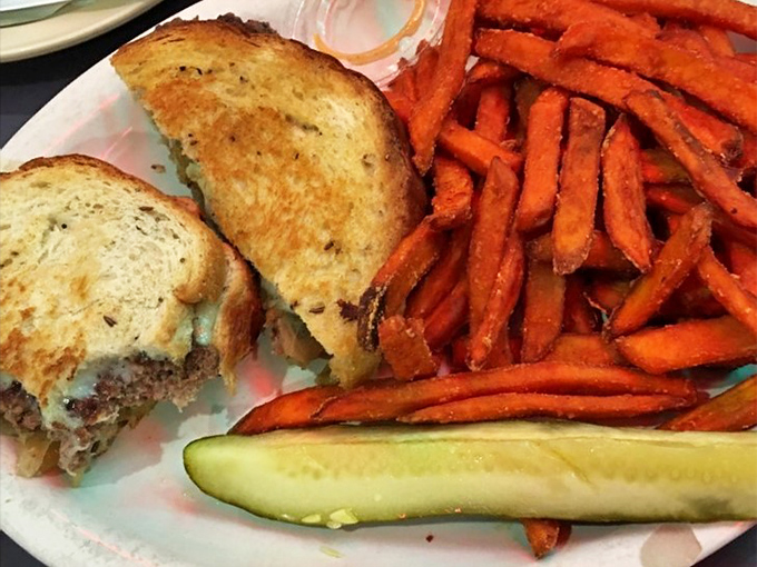 A proper patty melt should be crispy, gooey, and served with sweet potato fries. The Owl nails this American classic.