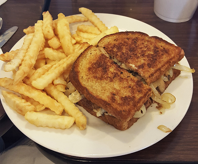 A perfectly executed patty melt with crispy fries. Some sandwiches are just therapy between bread, and this is definitely one of them.