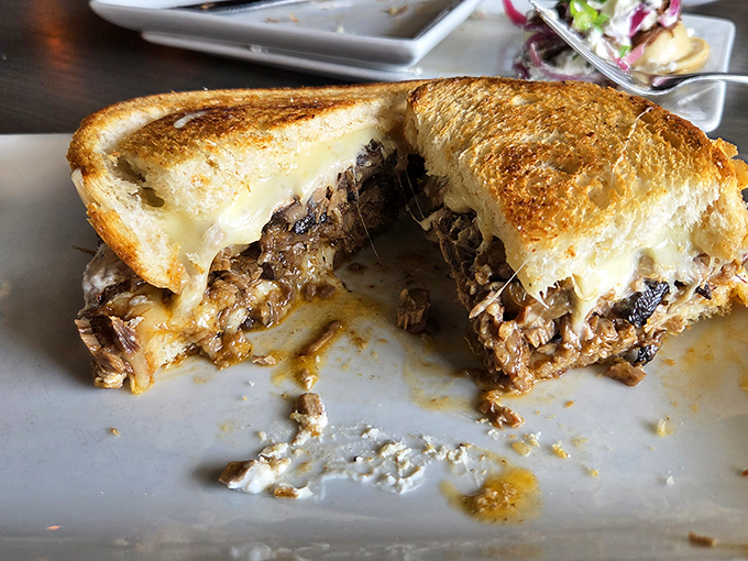 Melted cheese and tender brisket embrace toasted bread in what might be the Midwest's most comforting sandwich.