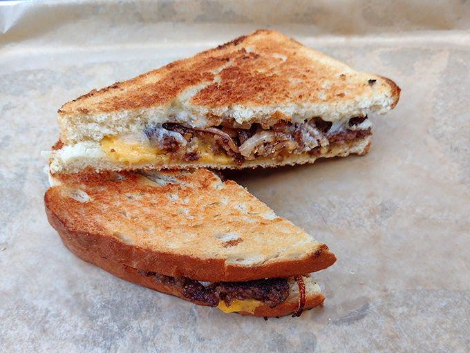 The Patty Melt&mdash;where grilled sourdough, melted cheese, and caramelized onions form a holy trinity around a perfectly smashed beef patty.