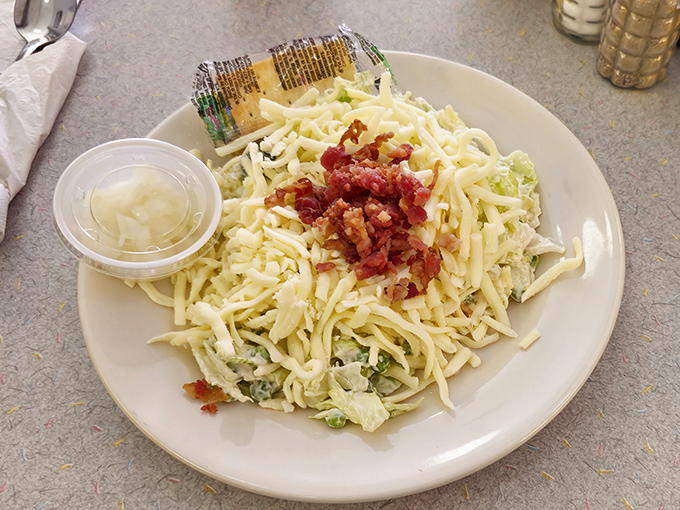 This pea salad with bacon bits isn't trying to win any beauty contests, but it might just win your heart.