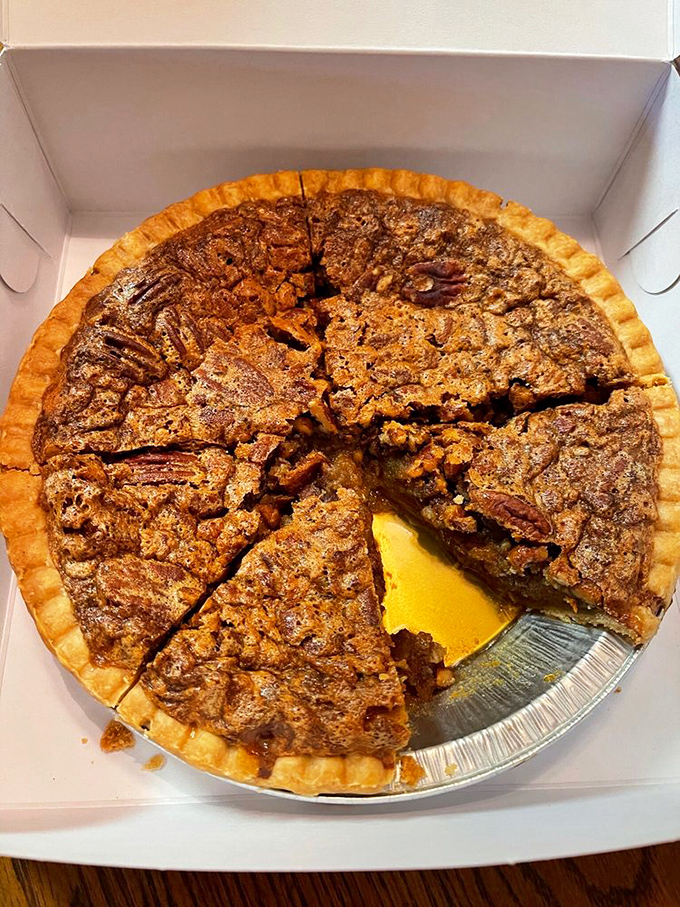 This pecan pie isn't just dessert, it's architecture &ndash; a perfect foundation of flaky crust supporting a caramelized pecan skyline.