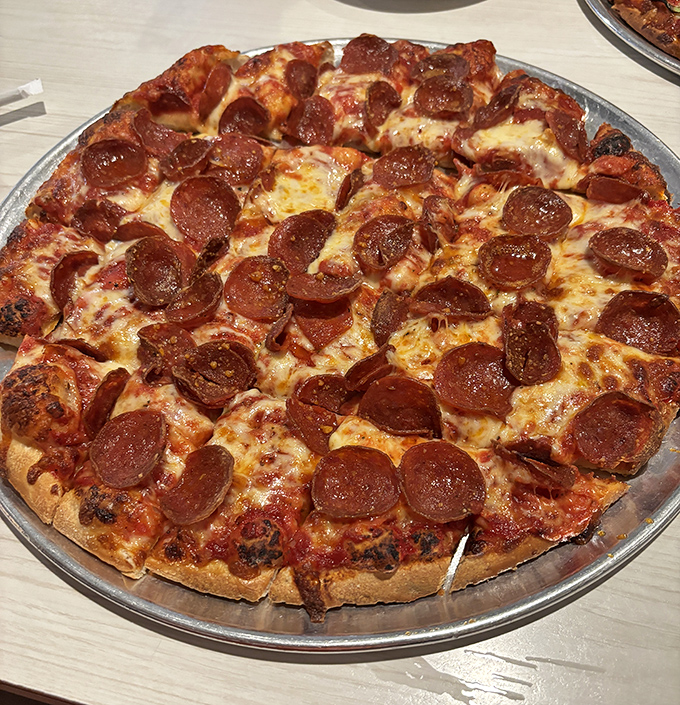 Pepperoni that curls into little flavor cups, creating those perfect crispy edges that pizza aficionados dream about at night.