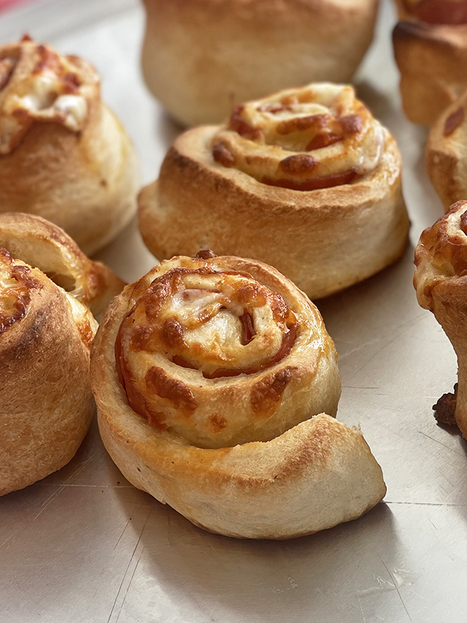 These aren't just pepperoni rolls &ndash; they're spiral-shaped flavor bombs waiting to detonate your taste buds. Carb-loading never looked so tempting.