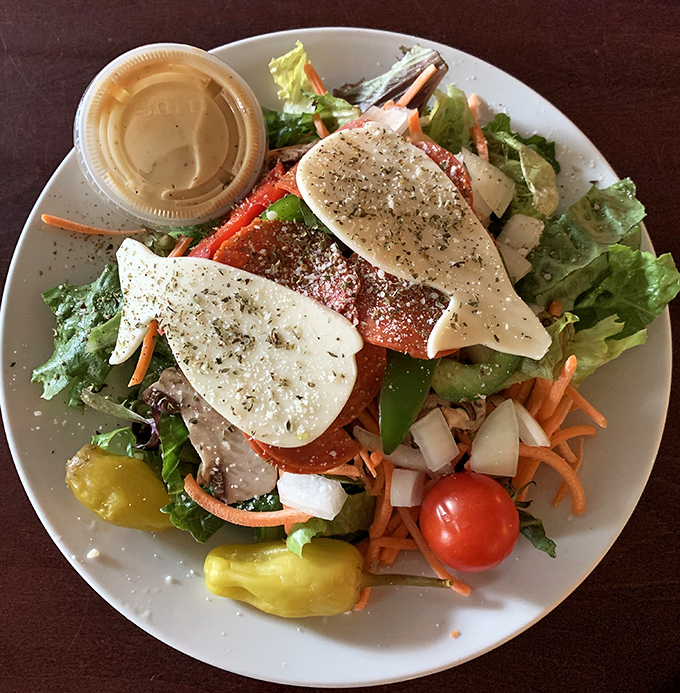 Between pizza rounds, this fresh salad offers a moment of virtuous eating. Those pepperoncini add just enough zip to wake up your palate.