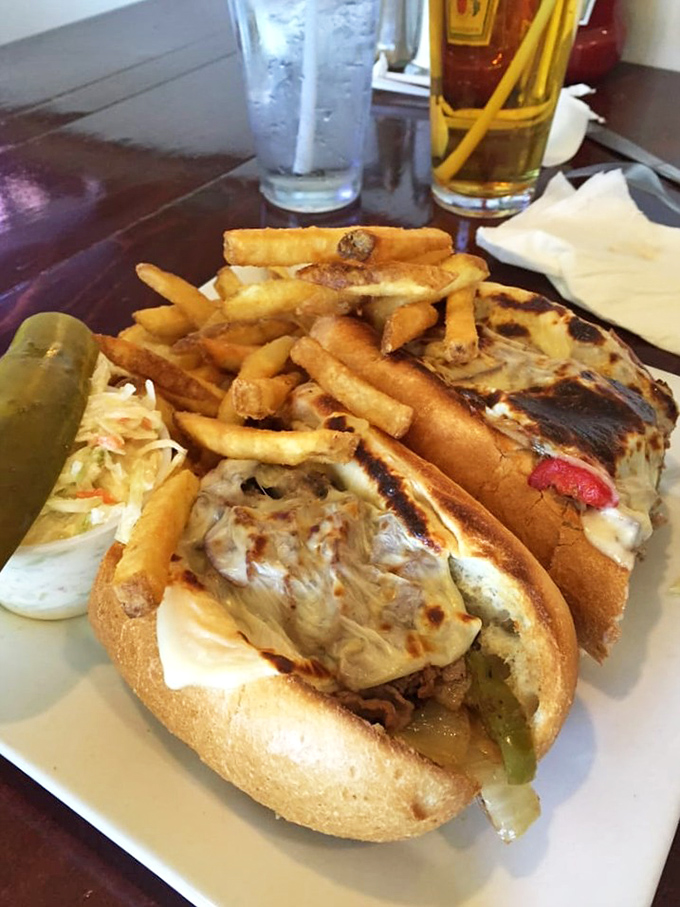 This isn't just a sandwich; it's a Philly cheesesteak manifesto with melted cheese cascading down the sides like delicious lava from Mount Delectable.