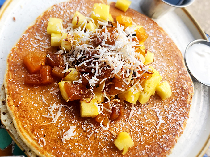 Golden pineapple pancakes that taste like vacation&mdash;topped with coconut shavings that make your taste buds feel like they're on a tropical getaway.