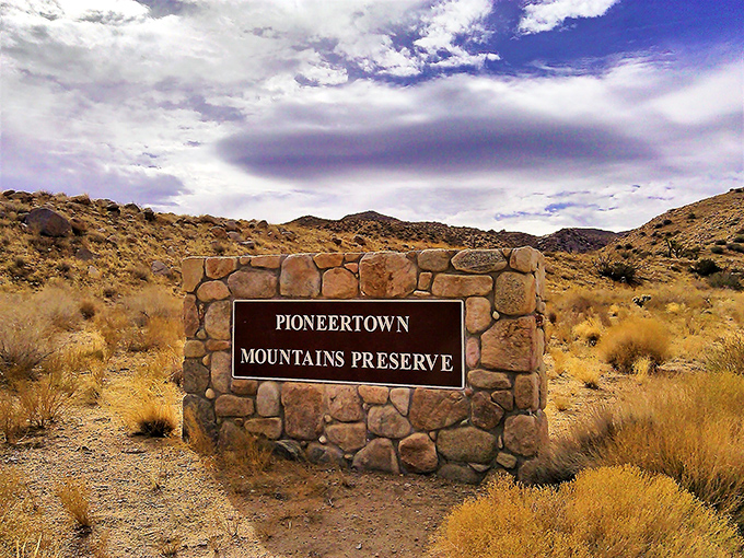 The Pioneertown Mountains Preserve sign marks the gateway to hiking trails where desert solitude and spectacular vistas await the adventurous.