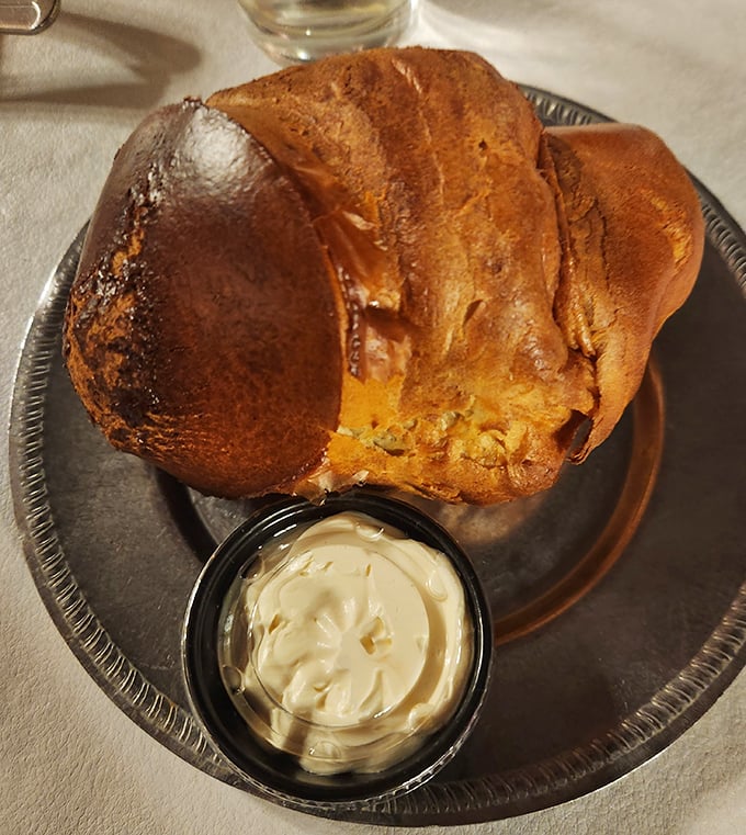 Not just any popover—this is the Marlon Brando of popovers: dramatic, imposing, and impossible to ignore. The butter dish is just trying to keep up.