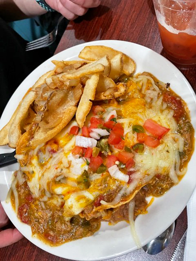 The pork chili verde &ndash; a masterpiece of melted cheese, savory sauce, and fresh pico de gallo that makes you wonder why you'd ever eat breakfast anywhere else.