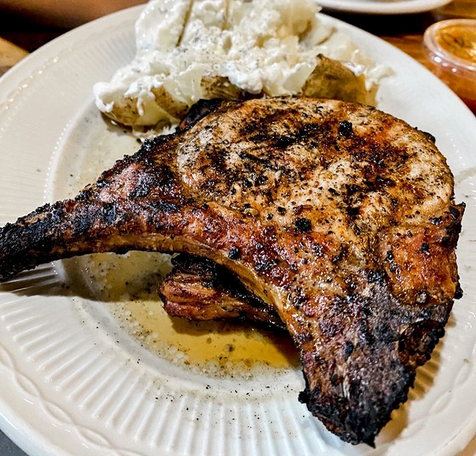 This pork chop has the kind of char that makes vegetarians question their life choices. Juicy, seasoned perfection on a plate.