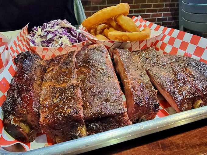 Perfectly pink pork ribs with that coveted smoke ring, served with no-nonsense sides. Napkins required, diets abandoned.