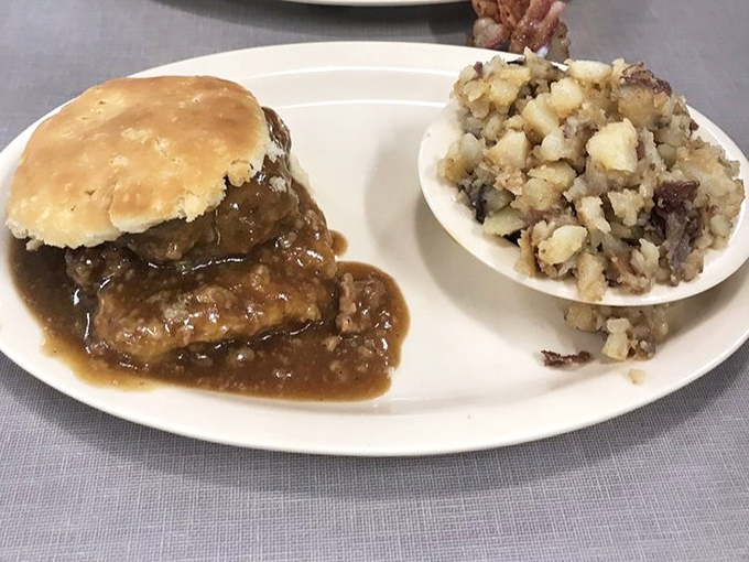 Country-style steak smothered in rich brown gravy alongside home-fried potatoes &ndash; Southern comfort that hugs your soul from the inside out.