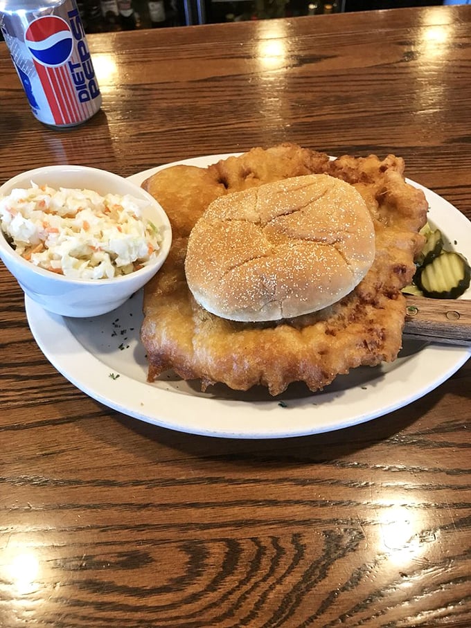 The legendary Iowa pork tenderloin&mdash;where the bun plays hide-and-seek with a golden-fried pork cutlet that's decided to live its best life by expanding beyond all reasonable boundaries. 