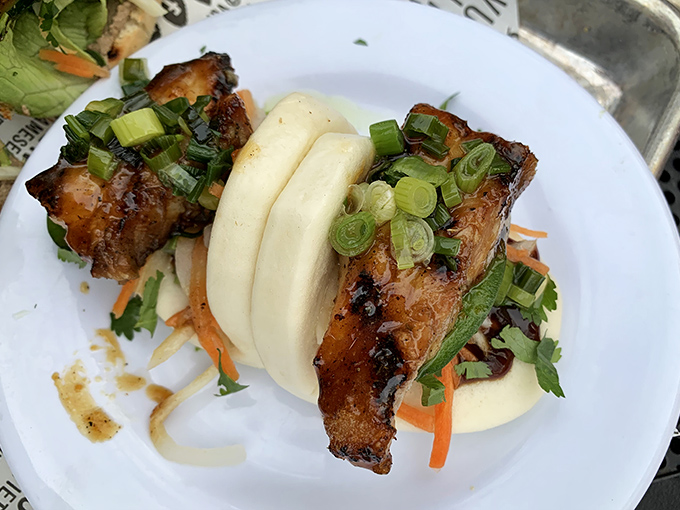 These pork belly bao buns aren't just a snack—they're a revelation of textures where pillowy dough meets caramelized meat in perfect harmony.