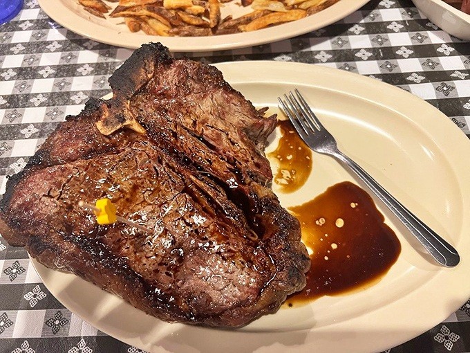 This isn't just a steak—it's a monument to beef artistry, a carnivore's canvas where seasoning and flame create edible poetry.