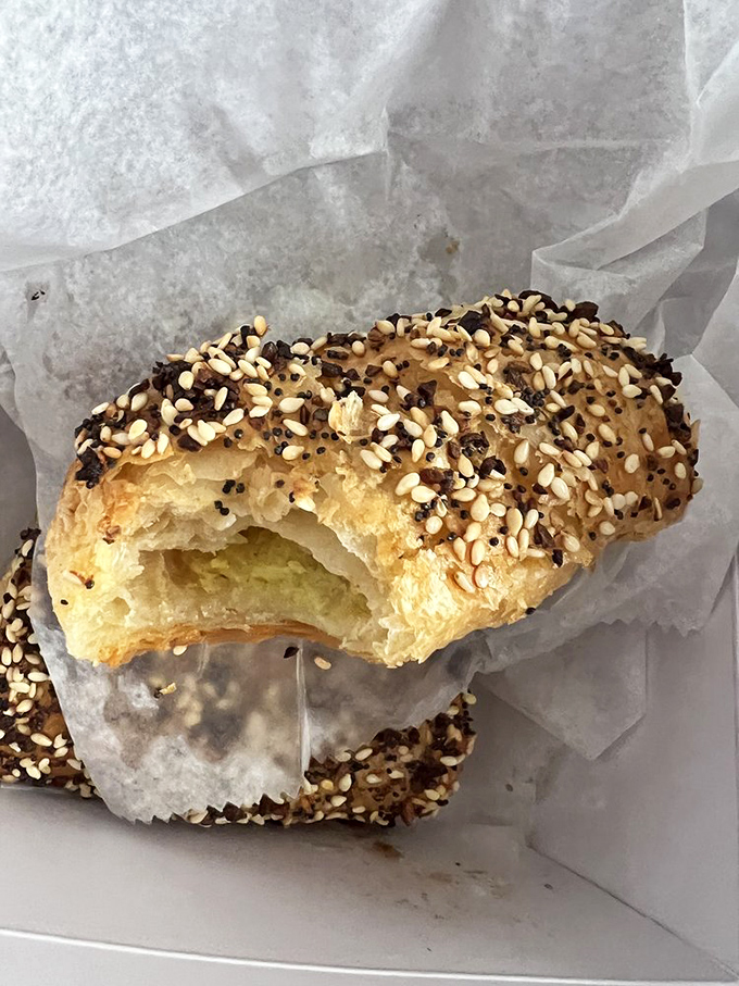 The potato borekas reveal their flaky, golden souls &ndash; these sesame-flecked pastries are what croissants dream of becoming in their next life.