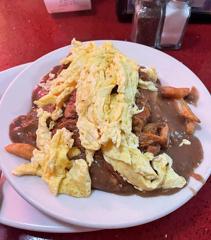 Breakfast poutine that makes Canadians nervous. This glorious mess of potatoes, gravy, and eggs is what your doctor warned you about&mdash;and your soul craves.