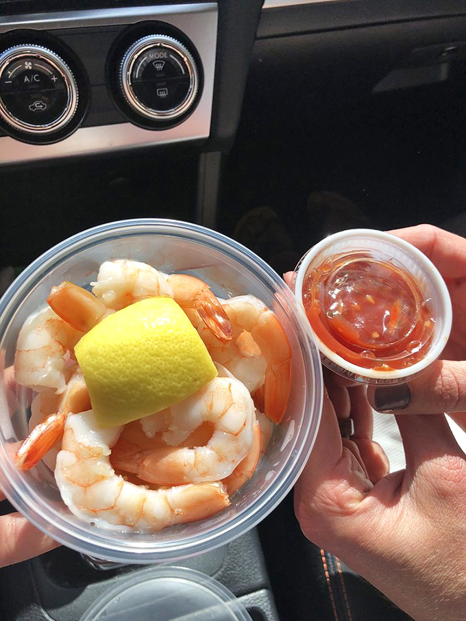 Ocean-to-spoon perfection! Plump shrimp nestled beside zesty cocktail sauce &ndash; proof that sometimes the simplest pleasures deliver the most profound satisfaction.