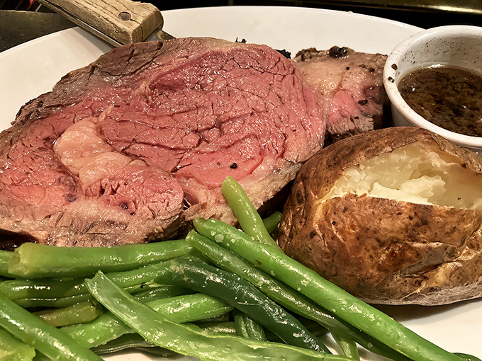 The prime rib arrives like royalty on a white throne&mdash;perfectly pink, impossibly tender, with a baked potato sidekick worthy of its own fan club.