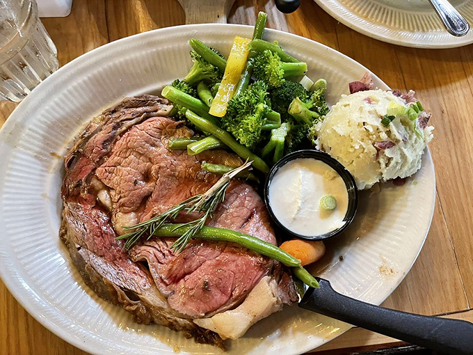 The prime rib arrives like royalty&mdash;perfectly pink, herb-crusted, and accompanied by vegetables that know their supporting role.